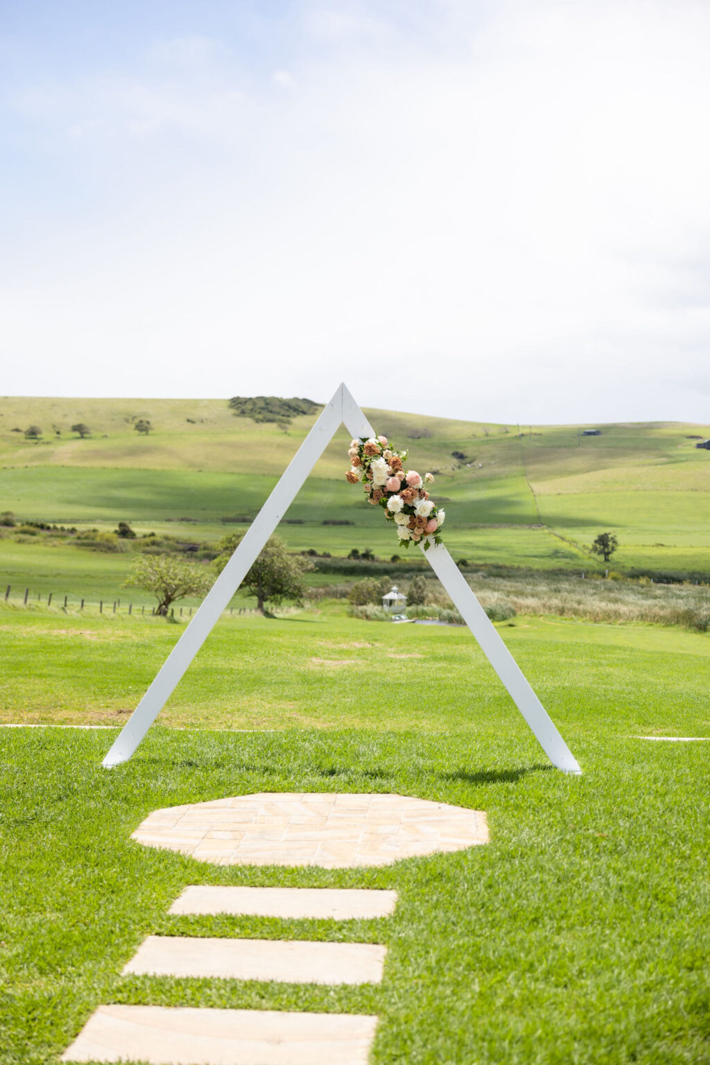 WHITE WOODEN TRIANGLE ARBOUR - The Wedding Creators