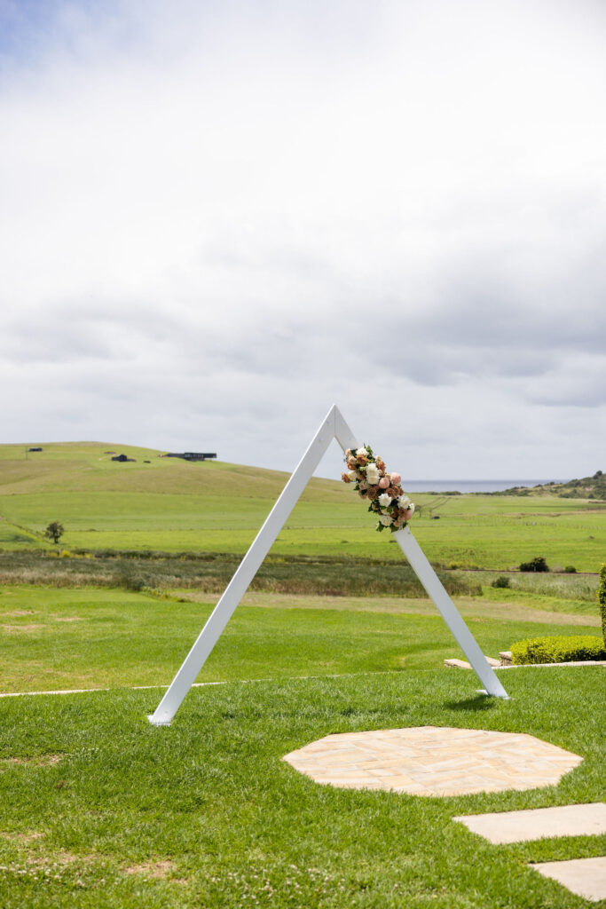 WHITE WOODEN TRIANGLE ARBOUR - The Wedding Creators